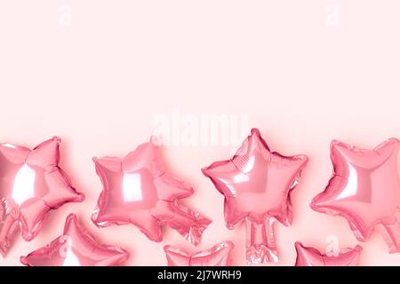 Frame made of pink inflatable foil balloons in a heart shape. Concept ...