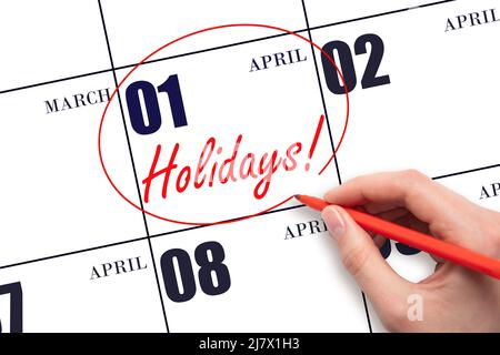 1st day of April. Hand writing text SALE and drawing gift boxes on ...