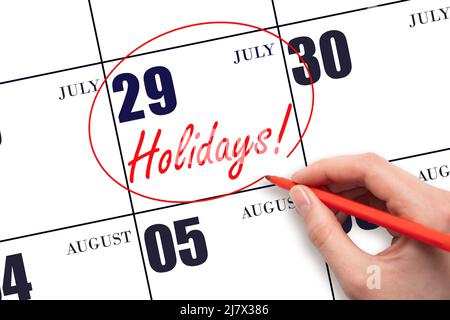 29th day ofJuly. Hand drawing a red circle and writing the text TRAVEL ...