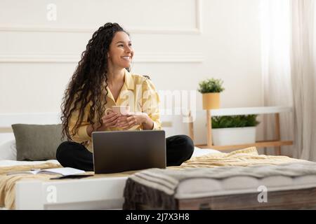 Smiling Young Arab Woman Drinking Coffee And Using Digital Tablet In ...
