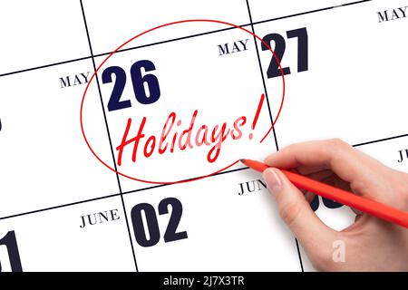 26th day of May. Hand writing text GOAL PLAN ACTION on calendar date ...