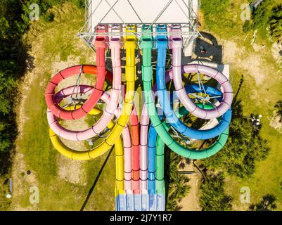 Colorful slide tubes at a water park Stock Photo - Alamy