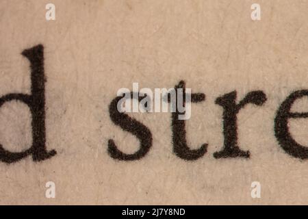 Text printed on old cheap paper under the microscope Stock Photo - Alamy