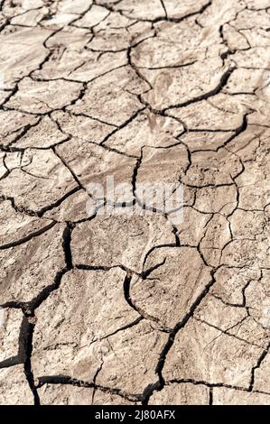Dry soil surface with deep cracks textured background. Dried and ...