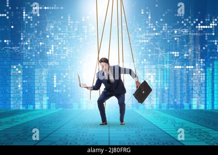 Businessman puppet being manipulated by ropes Stock Photo - Alamy