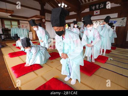 GUAM (May 12, 2022) -- From left, Capt. Steven Wasson; Capt. John Bub ...