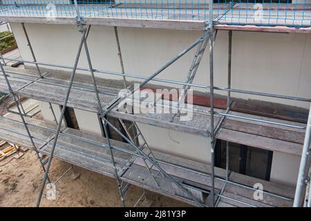 Scaffolding on outside of large house Stock Photo - Alamy