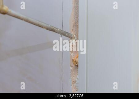 Installation of doors using polyurethane foam. Cylindrical foam. Yellow ...