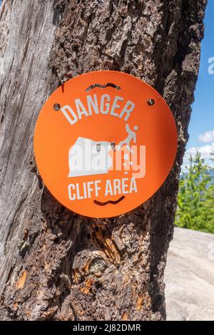 Sign warning of the danger of falling from the cliff, skiing Stock ...