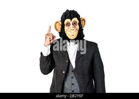 Monkey man pointing upward with his index finger looking up Stock Photo ...