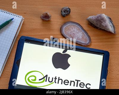 In this photo illustration AuthenTec, Inc. owned by Apple Inc. logo seen displayed on a tablet ...