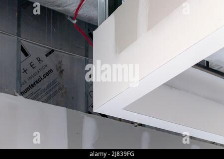 Overhead drywalled soffits in a commercial building. New Construction ...