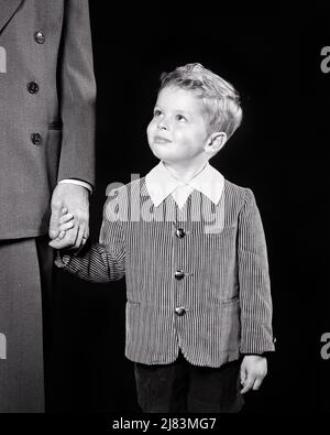 1950s FATHER SMILING AT SON STUDIO PORTRAIT Stock Photo - Alamy