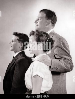 1950s FATHER SMILING AT SON STUDIO PORTRAIT Stock Photo - Alamy