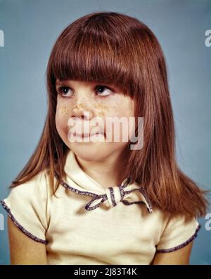Little girl, silly and goofy face on green screen with facial expressions against a studio ...