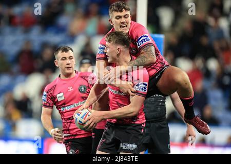 Matty Nicholson #30 of Wigan Warriors goes over for a try on his debut ...