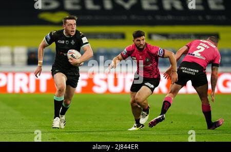 Huddersfield Giants' Jake Bibby (centre) in action during the Betfred ...