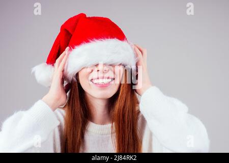 beautiful redhaired ginger woman wearing white knitted sweater and ...