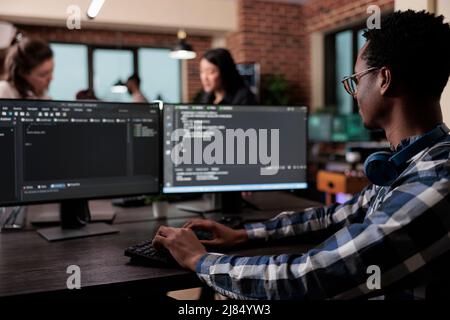 African american system engineer thinking about html script development to code it language in ...