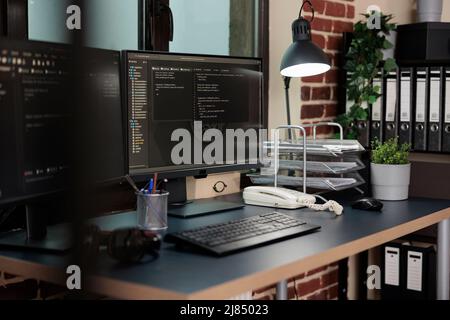 Empty office with multiple monitors showing hacking attack alert, IT ...