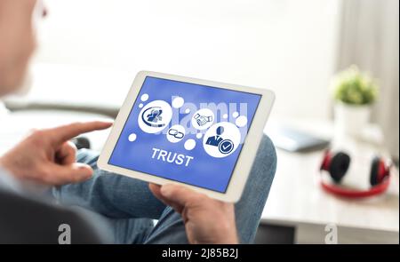 Tablet screen displaying a trust concept Stock Photo - Alamy