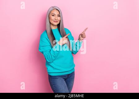 Photo of pretty positive person direct finger hand hold paper little ...