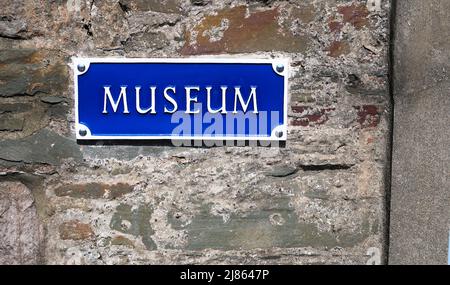 Blue sign on a stone wall at the bridge Pont De Bir Hakeim entrance ...