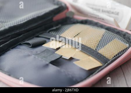 adhesive bandage and a bag on table Stock Photo - Alamy