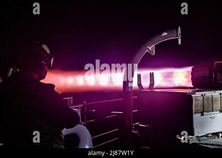 Aviation Machinist's Mate conducts an engine cell test on the fantail ...