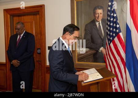 Defense Secretary Lloyd Austin waits for the arrival of Japanese ...