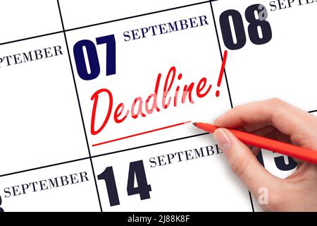 7th day of September. A hand writing a VACATION text and drawing a ...