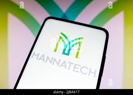 In this photo illustration the Mannatech logo seen displayed on a ...