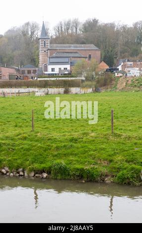 Bassenge, Liege, Belgium - 04 03 2022 - The square and catholic church ...