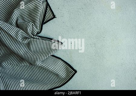 Kitchen textile towel on concrete table background with copy space ...