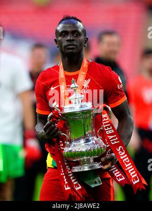 Liverpool's Sadio Mane celebrates with the trophy after the UEFA ...