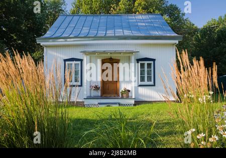 Small old circa 1866 Canadiana cottage style home with white clapboard ...