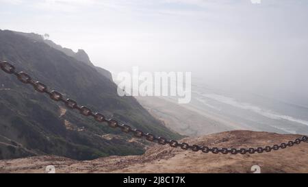 Steep unstable cliff, rock or bluff, foggy weather, California coast ...