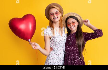 glad kid hold love heart on yellow background, valentine day Stock Photo - Alamy