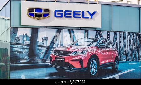 Geely. A sign with the Geely logo on the dealership building Stock ...