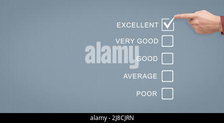 Evaluation form tick excellent by businessman Stock Photo - Alamy