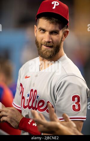 Bryce Harper #3 of the Philadelphia Phillies looks on in the dugout during a game against the St ...