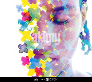 Portrait of contemporary male artist painting pictures standing by ...