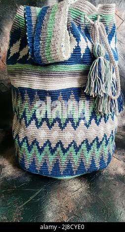 Handmade bags. Knitted from colored threads. Volumetric and comfortable ...