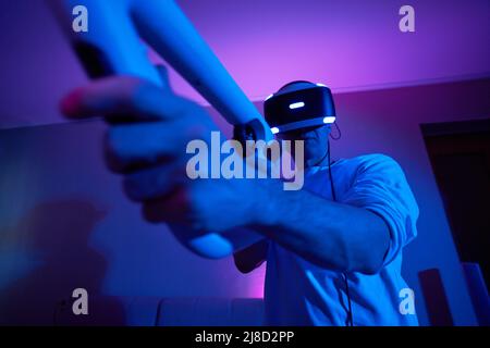Man with virtual reality headset and joystic is playing game Concept of ...