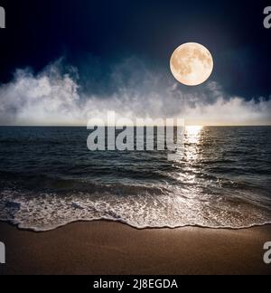 Sandy beach and moon at night Stock Photo - Alamy