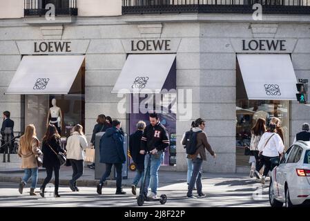 Pedestrians walk past the Spanish luxury clothing and accessories brand ...