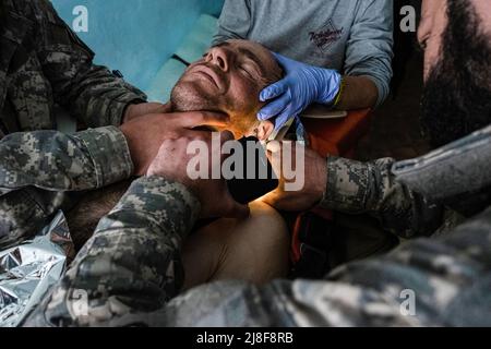 A soldier who suffered concussion and spinal trauma is visited by a ...