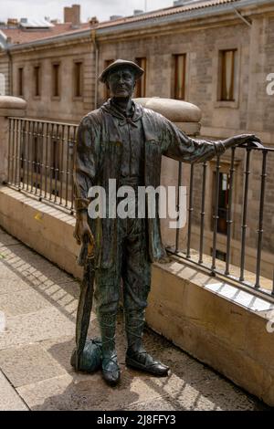 Statue of a typical Basque man with beret and cane on the Plaza del ...