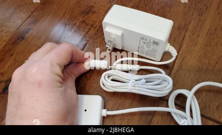 Person's hand assembling Govee Glide LED smart wall light, Lafayette ...