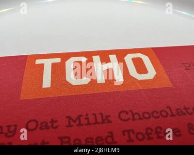 Close-up of logo for TCHO chocolate on chocolate bar against white ...